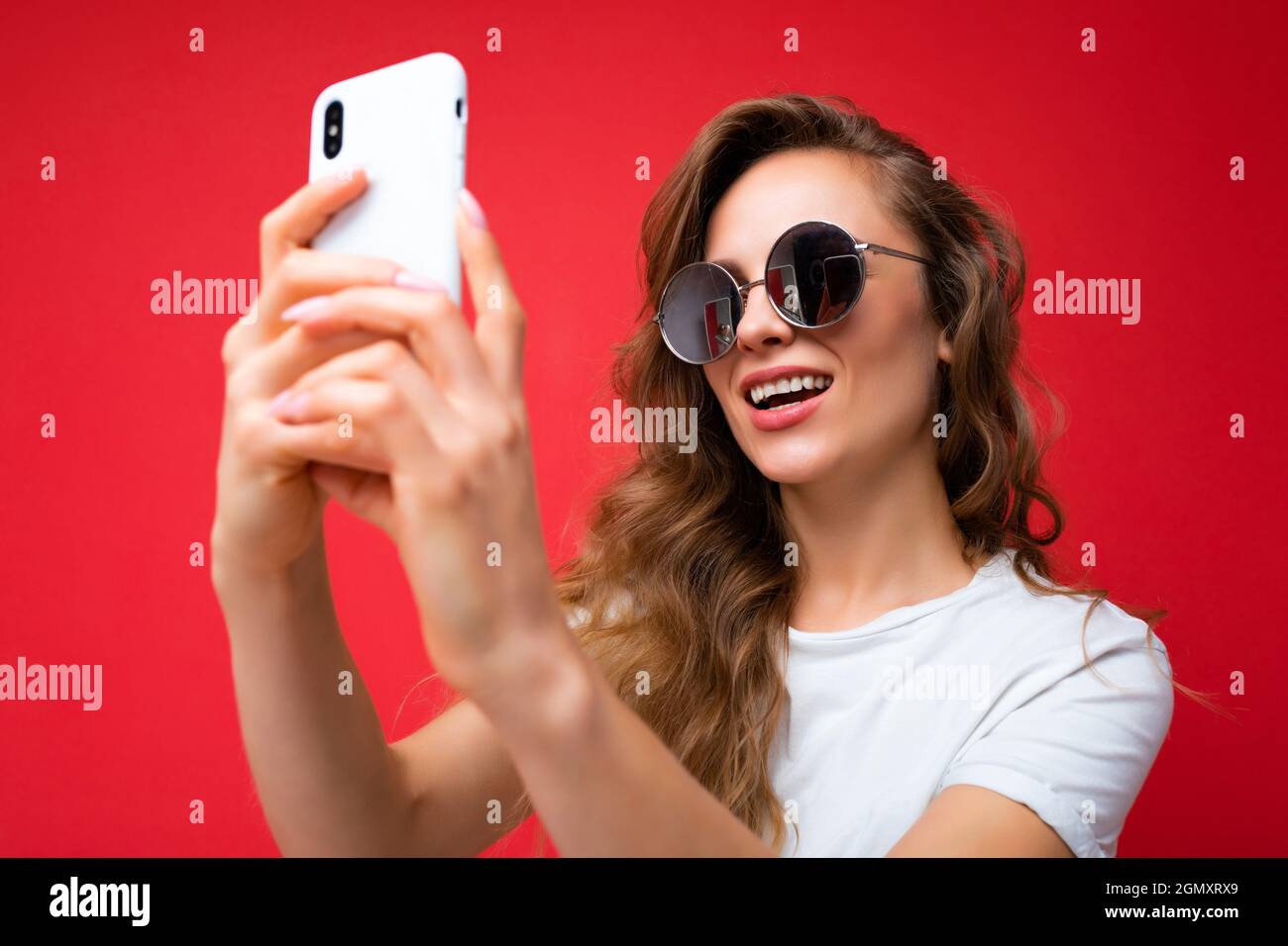 Closeup Photo Of Amazing Beautiful Young Blonde Woman Holding Mobile