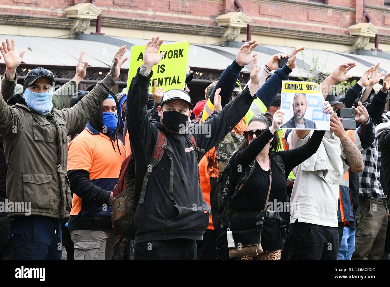 Melbourne, Australia, 21 September, 2021. Protesters raise their hands ...