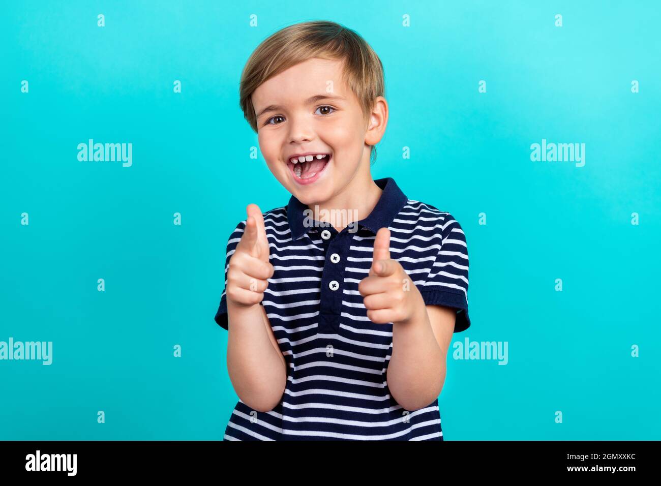 Photo of funky little boy point you wear striped t-shirt isolated on ...