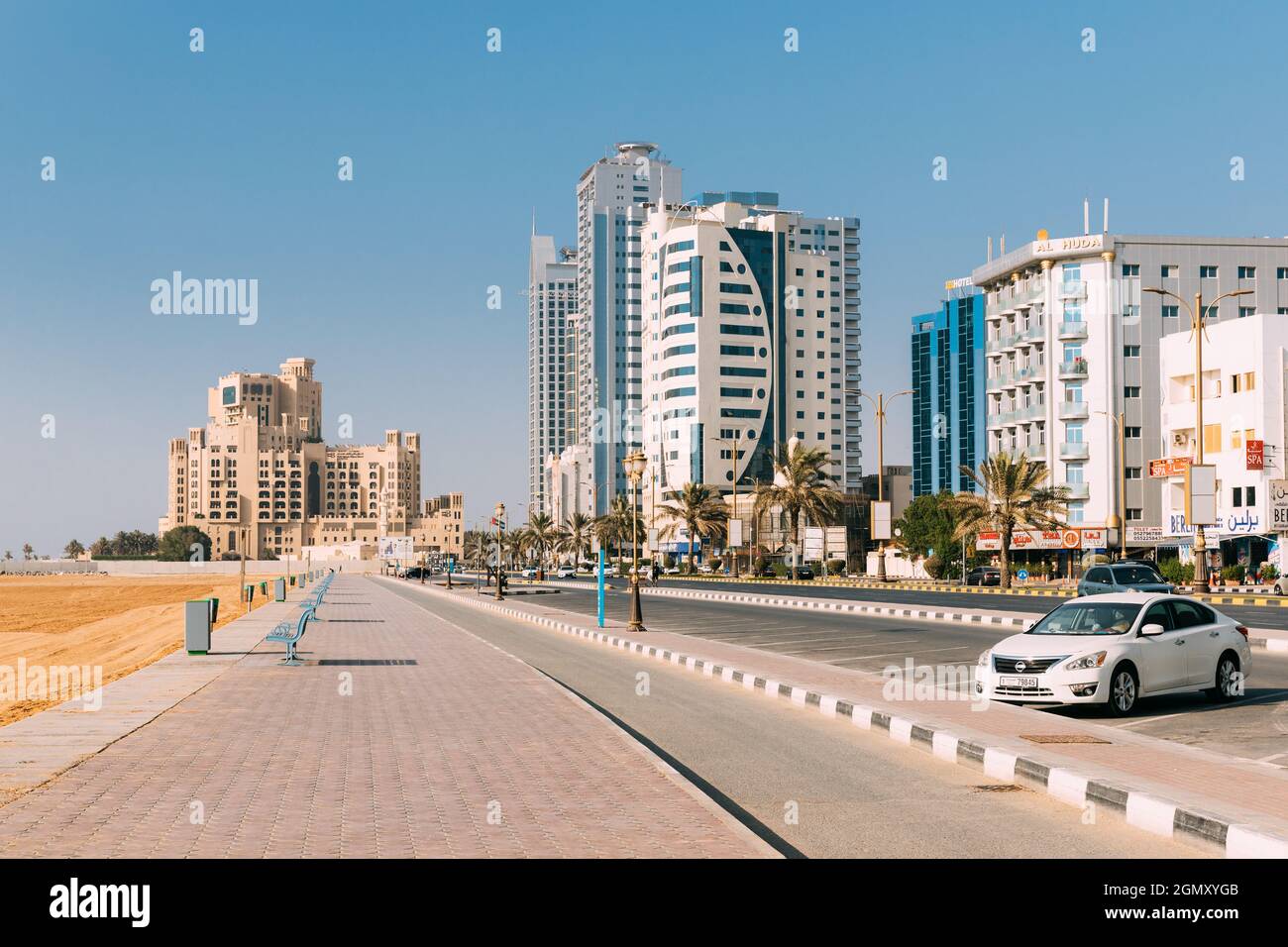 Nissan Car Parked In Street. Building Of Bahi Ajman Palace Hotel In ...