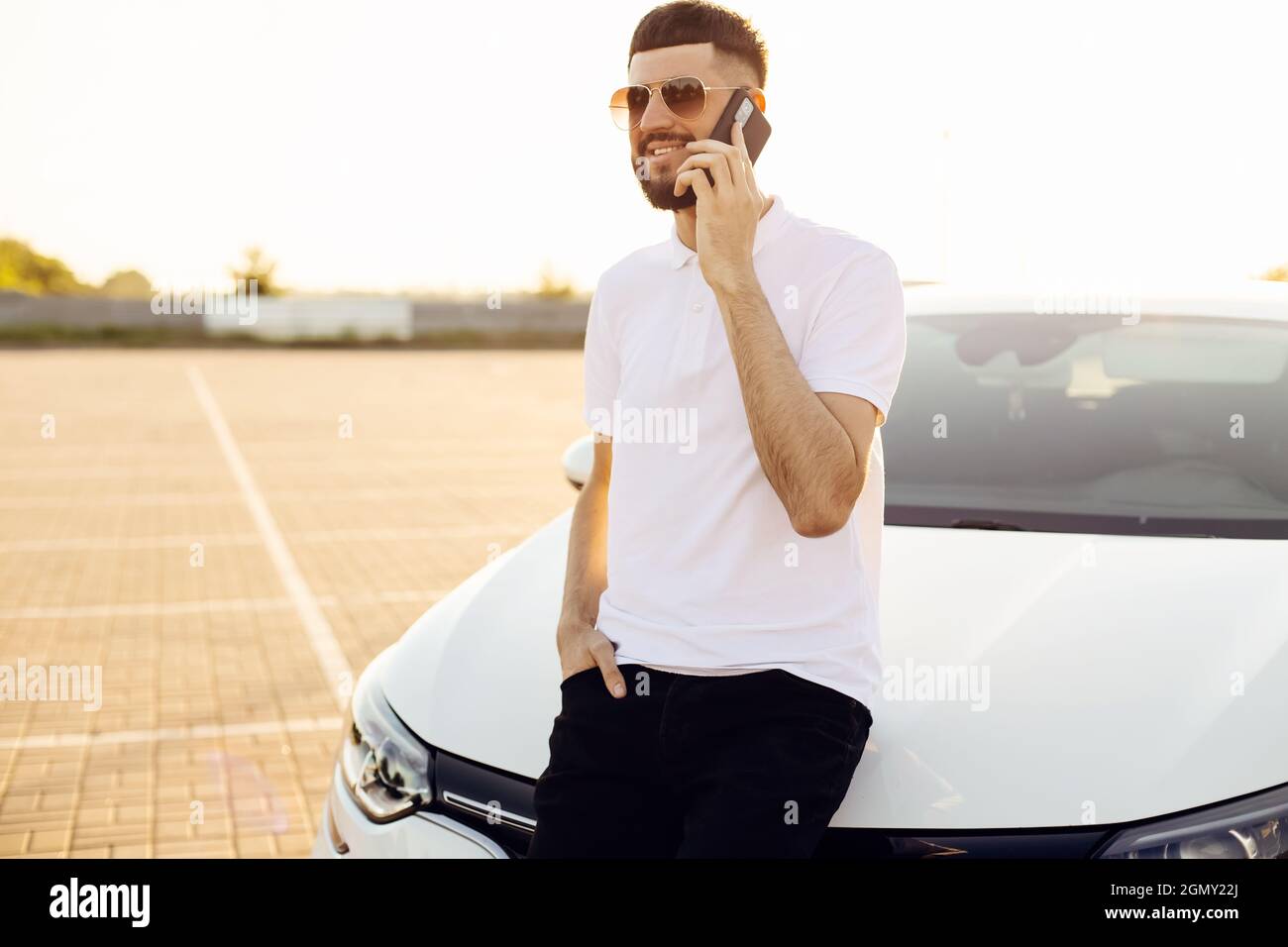 Handsome businessman glasses driving talking hi-res stock photography ...