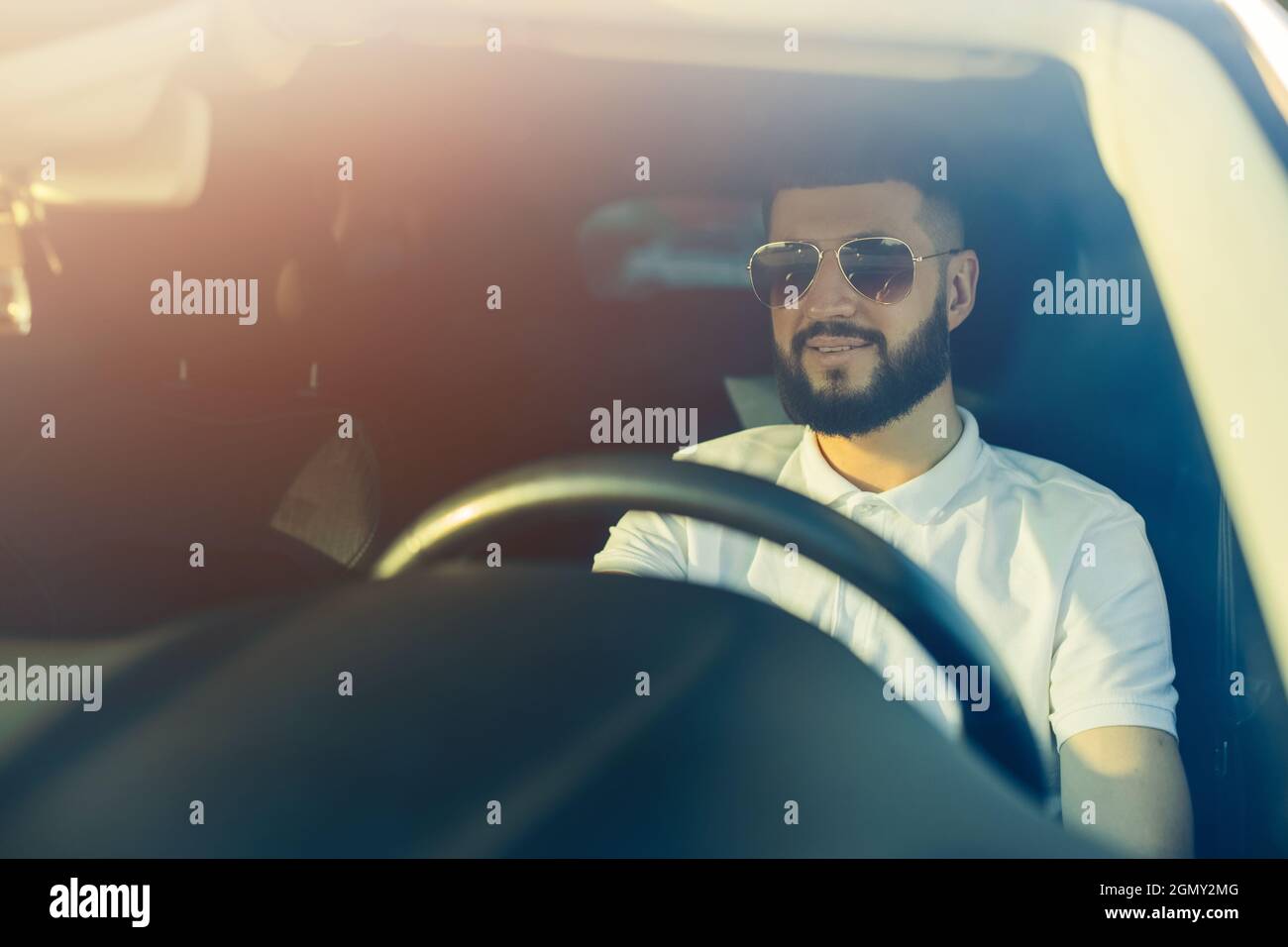 Handsome man driving on road hi-res stock photography and images - Alamy