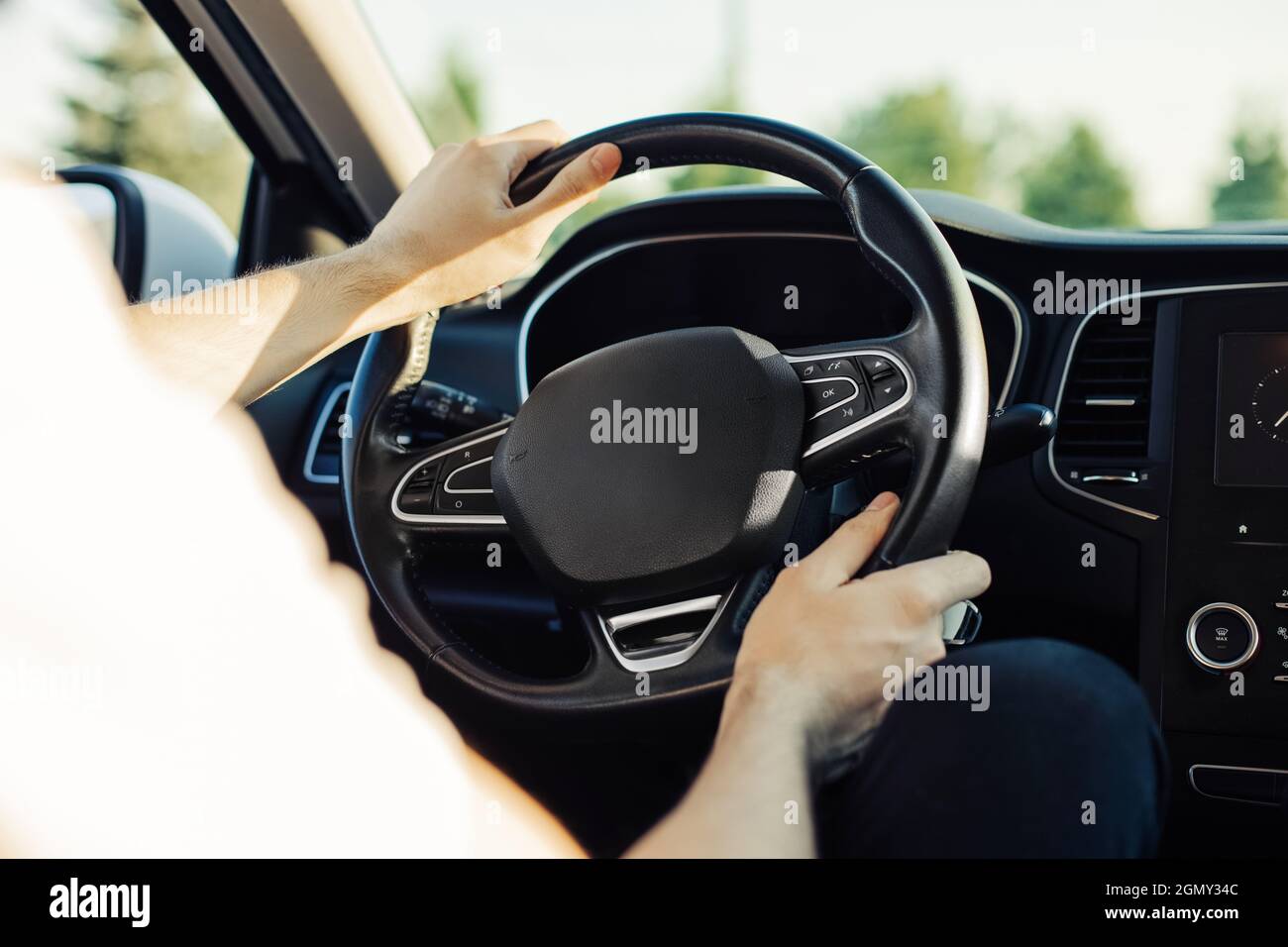 Man driving a car, from the rear view on the highway, an image of a man ...