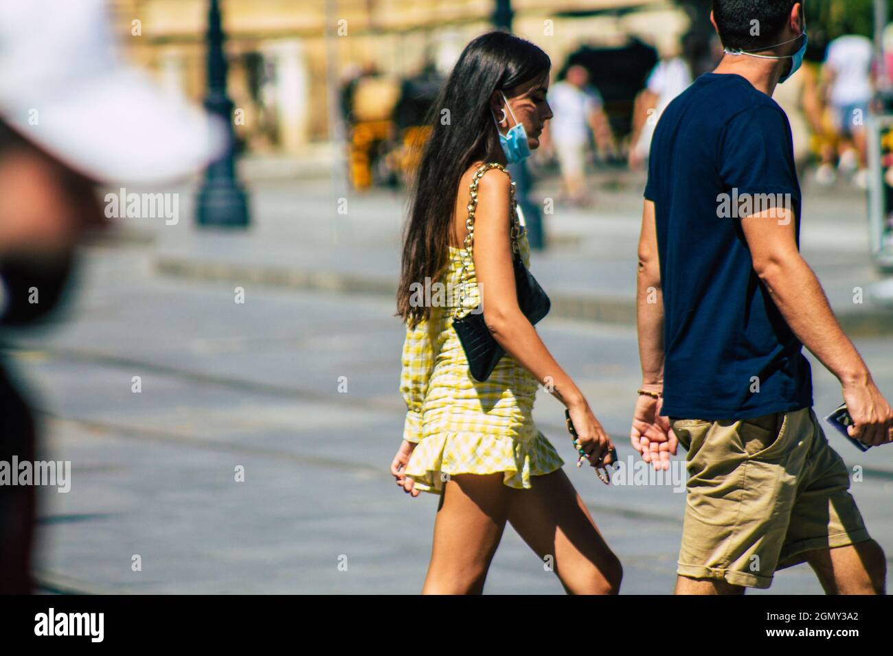 Seville Spain September 18, 2021 Pedestrians walking in the street ...