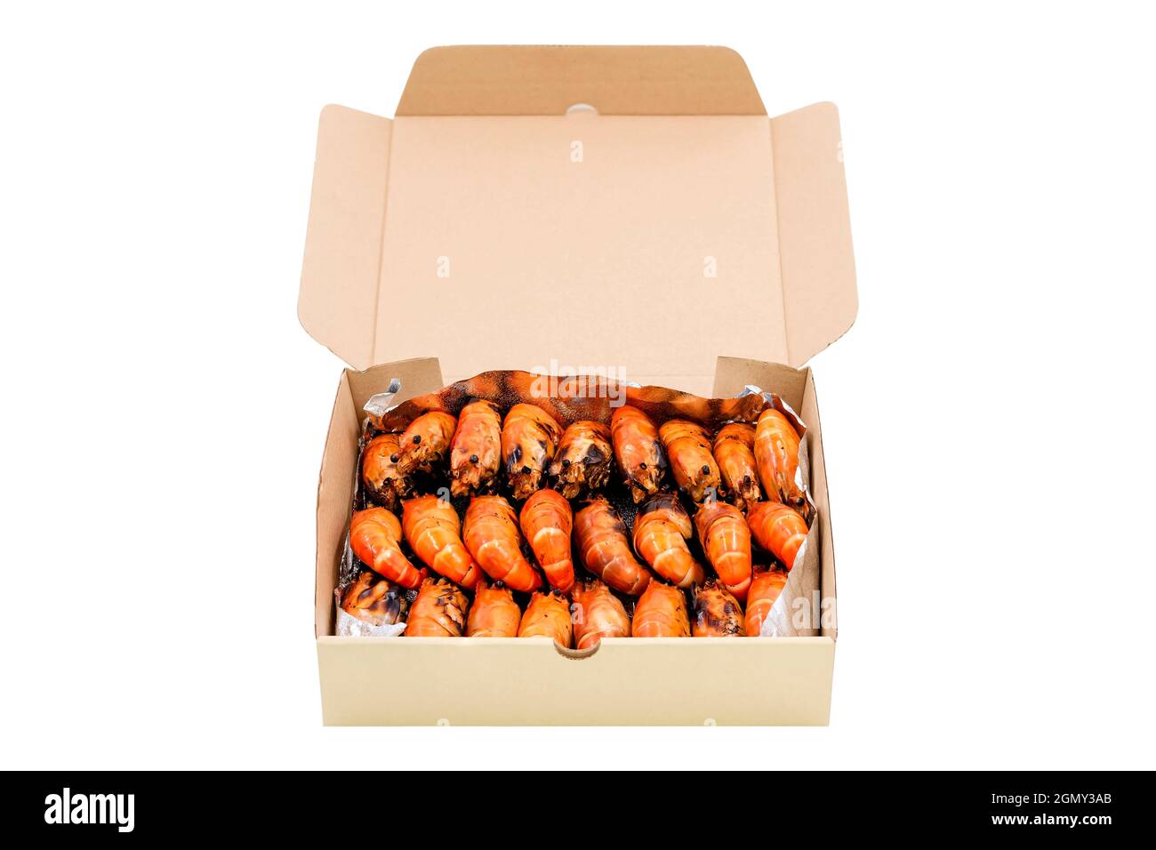 Group of grilled river prawns arrange in a paper box isolated on white ...