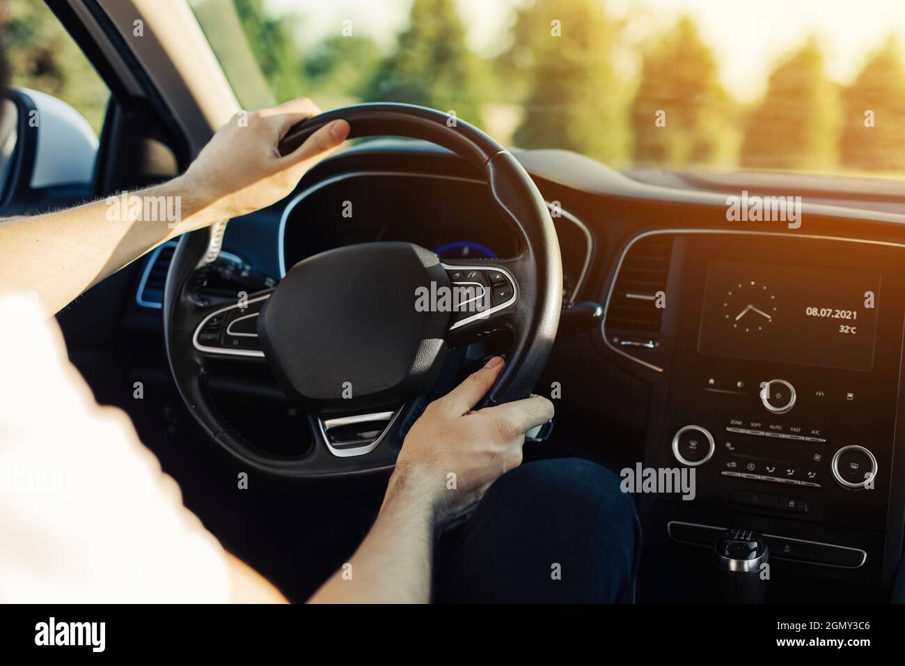 Man driving a car, from the rear view on the highway, an image of a man ...
