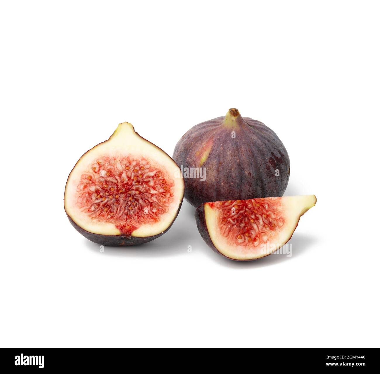 whole fruit and fig slices on white background Stock Photo - Alamy