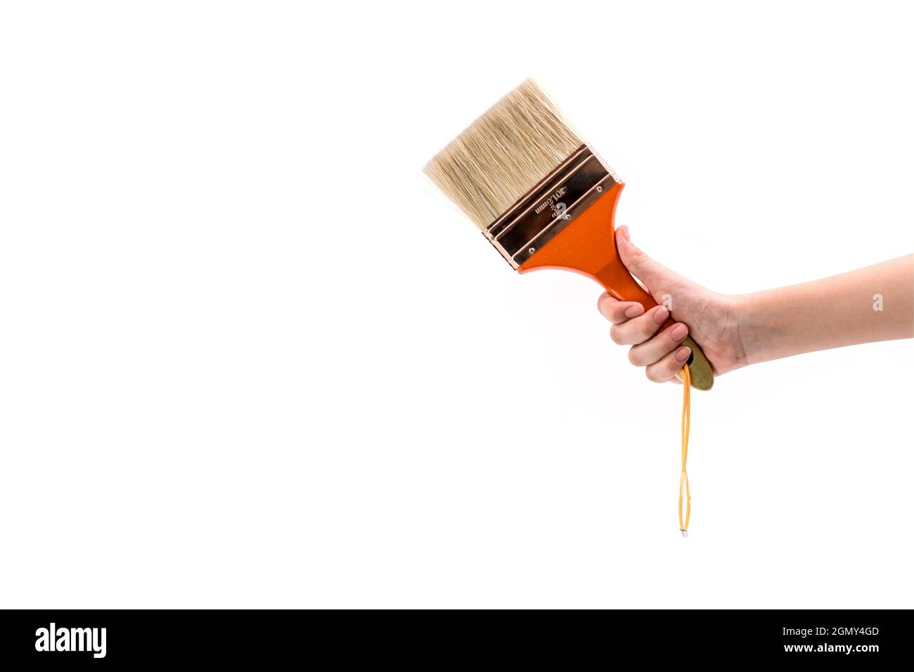 Close up human hand holding a paint brush isolated on white background ...