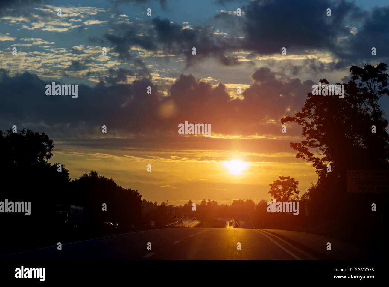 Colorful sunset at traffic on highway with cars Stock Photo - Alamy
