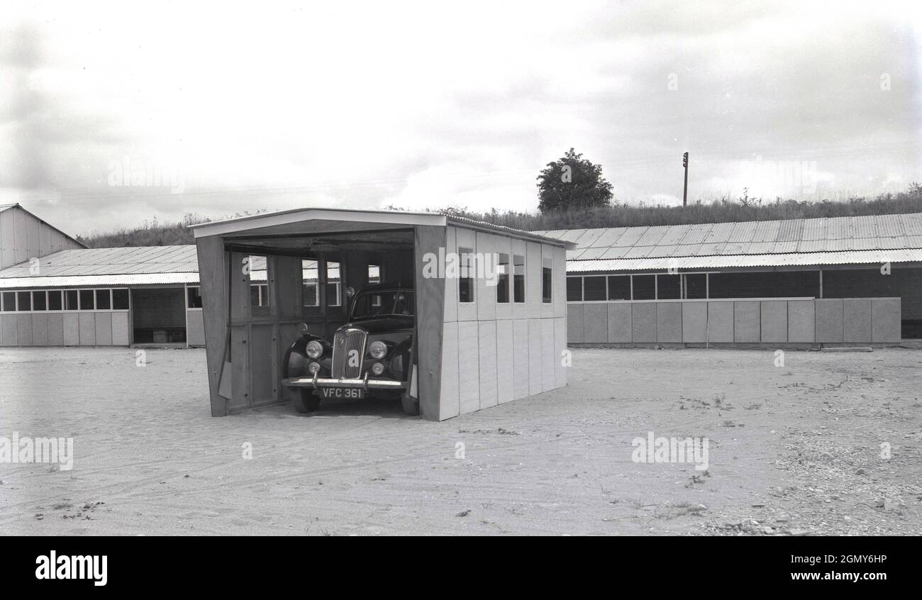 1950s, historical, outside on a wide, level area at a light industrial ...