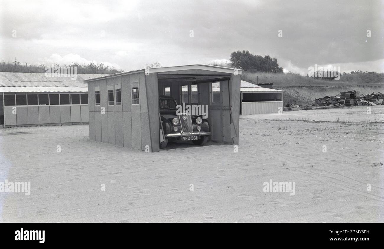 1950s, historical, outside on a wide, level area at a light industrial ...