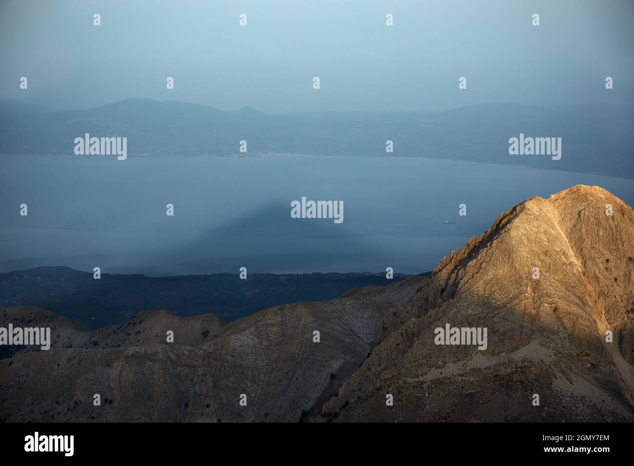 The shadow pyramid of the top of mountain Taygetos is seen below in the ...