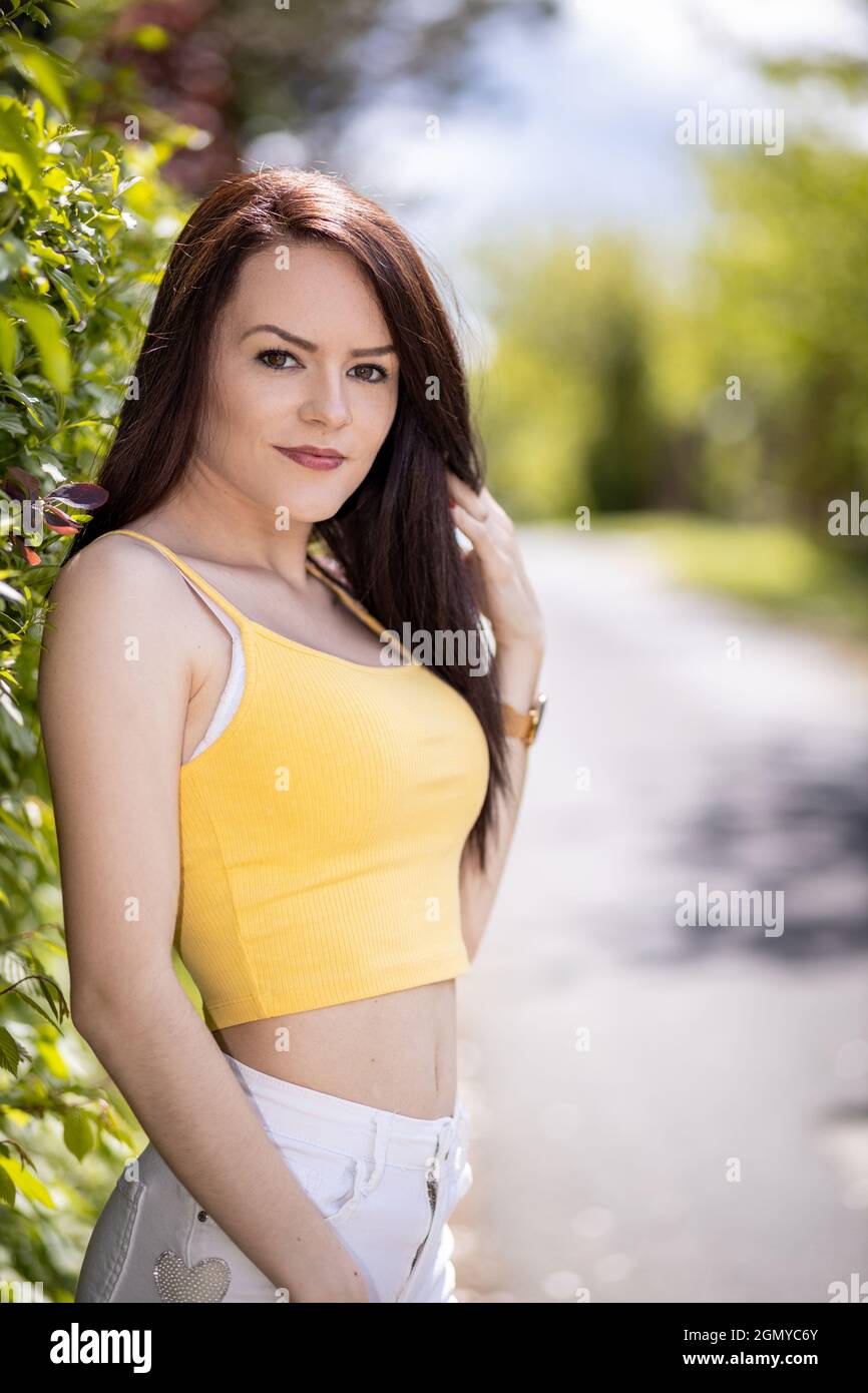 Woman in yellow top hi-res stock photography and images - Alamy