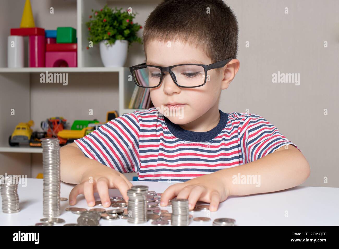 Child and coins - financial literacy for children, learning to spend ...