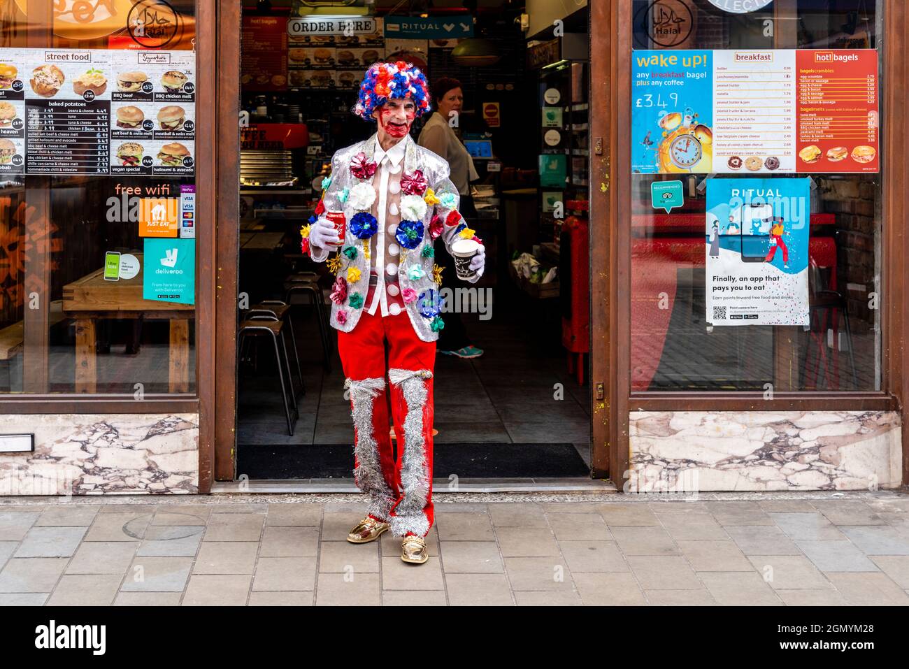 A Man Dressed In A Clown Costume Coming Out Of A Shop, Victoria Street ...