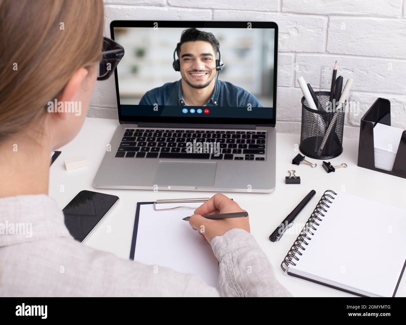 Concentrated millennial female study online, learn english and look at ...