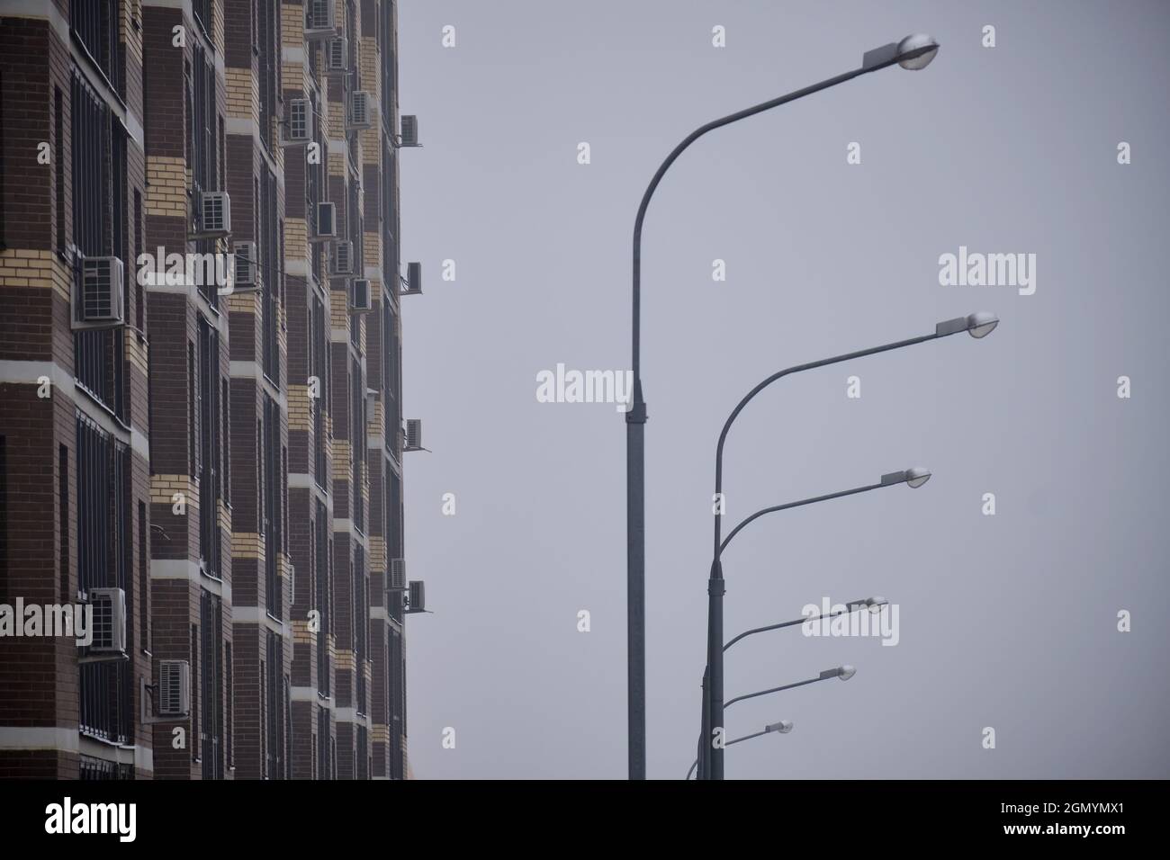 Windows on the facades of high-rise apartment buildings, smoke close-up ...