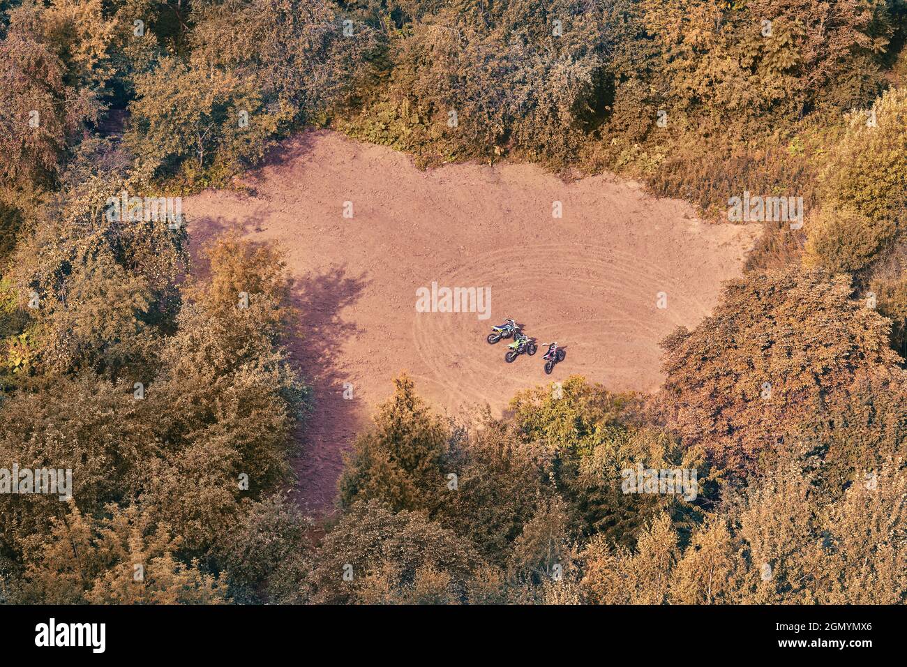 Riding motorcycles in the forest, top view. Cross country motocross ...