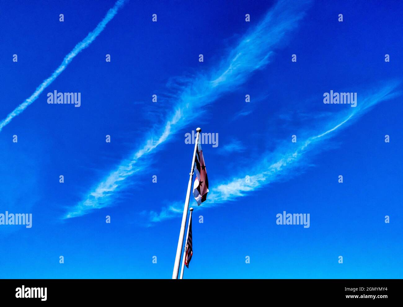 Flags against a cloud streaked sky Stock Photo - Alamy