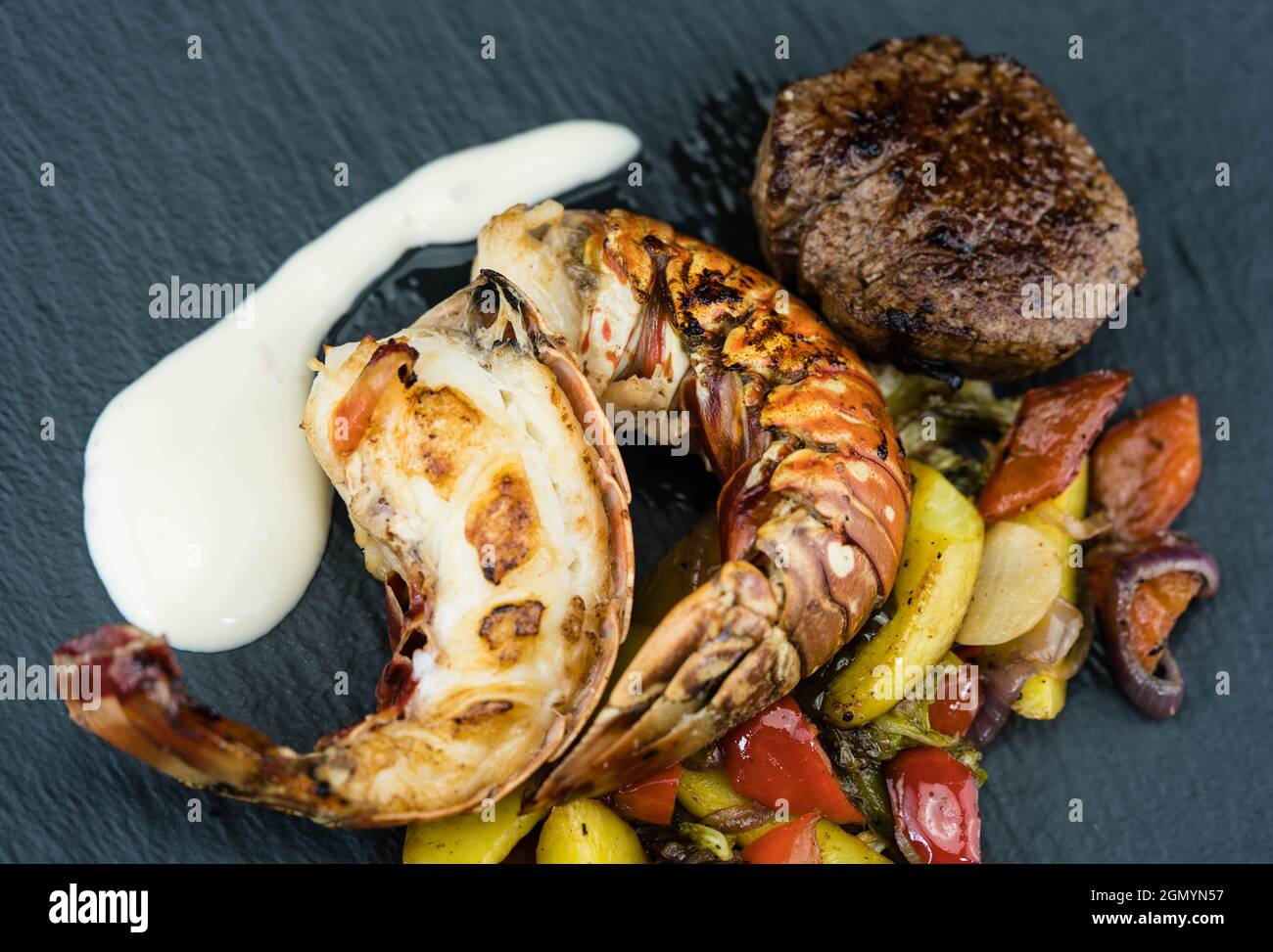 Surf and turf grilled fillet steak and crawfish Stock Photo - Alamy