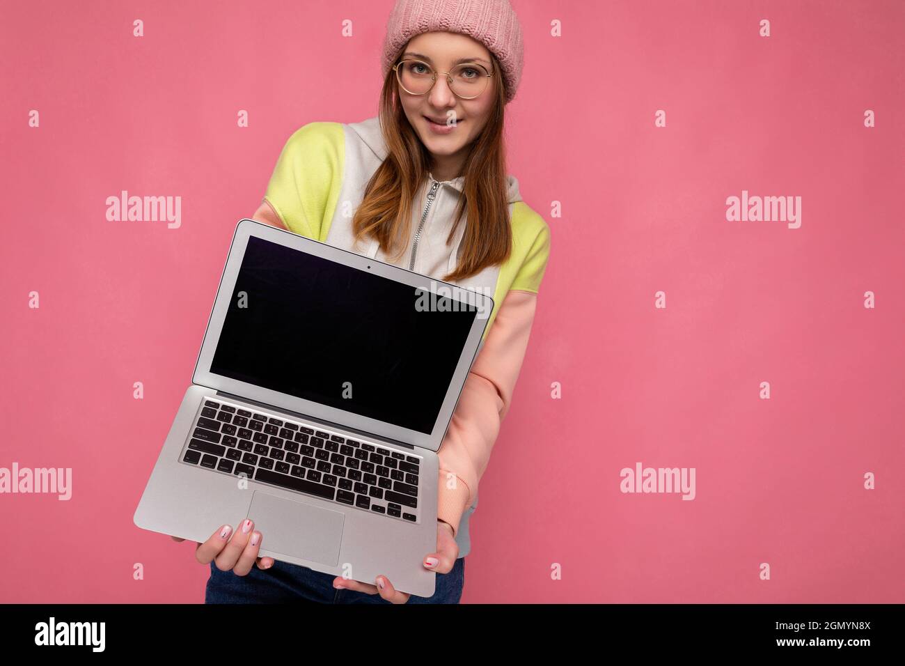 Beautiful smiling Pretty young woman wearing hat colorful sweater and ...