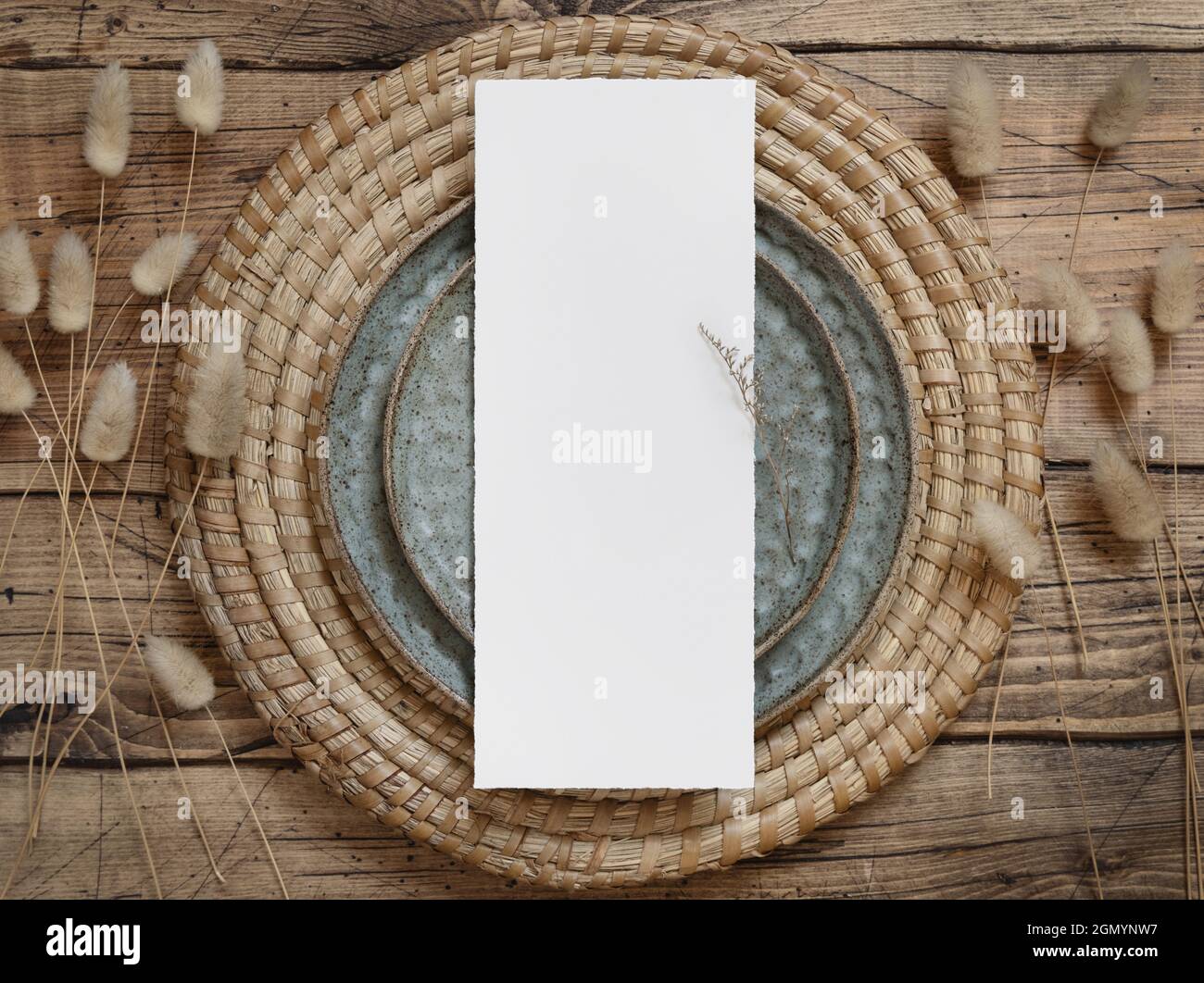 Blank menu card on plate on wooden table with bohemian decorations and ...