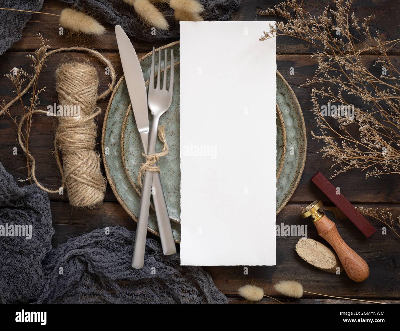 Blank menu card on plate with fork and knife on wooden table with ...