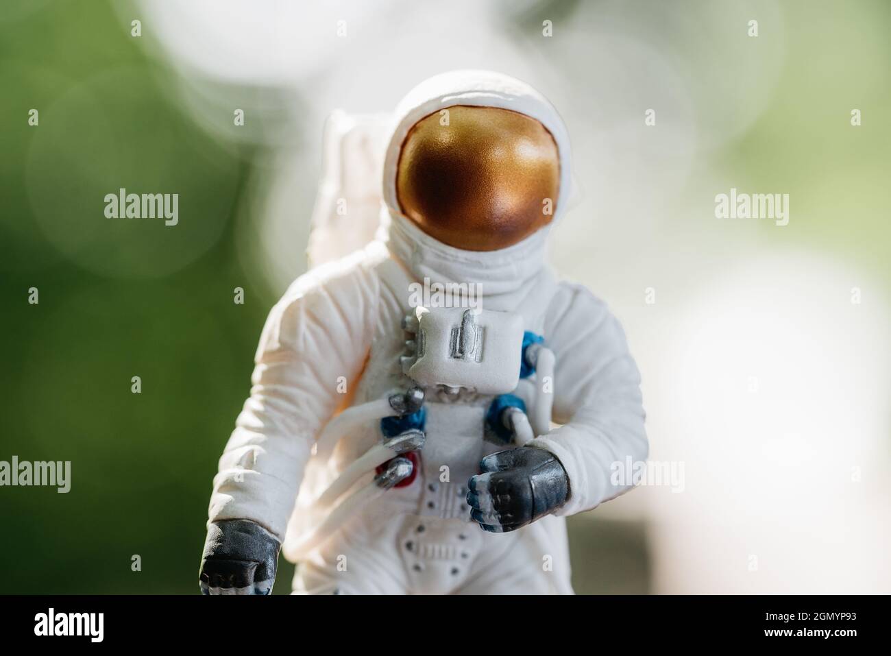 toy astronaut standing on ground. Spaceman figure Travel concept ...