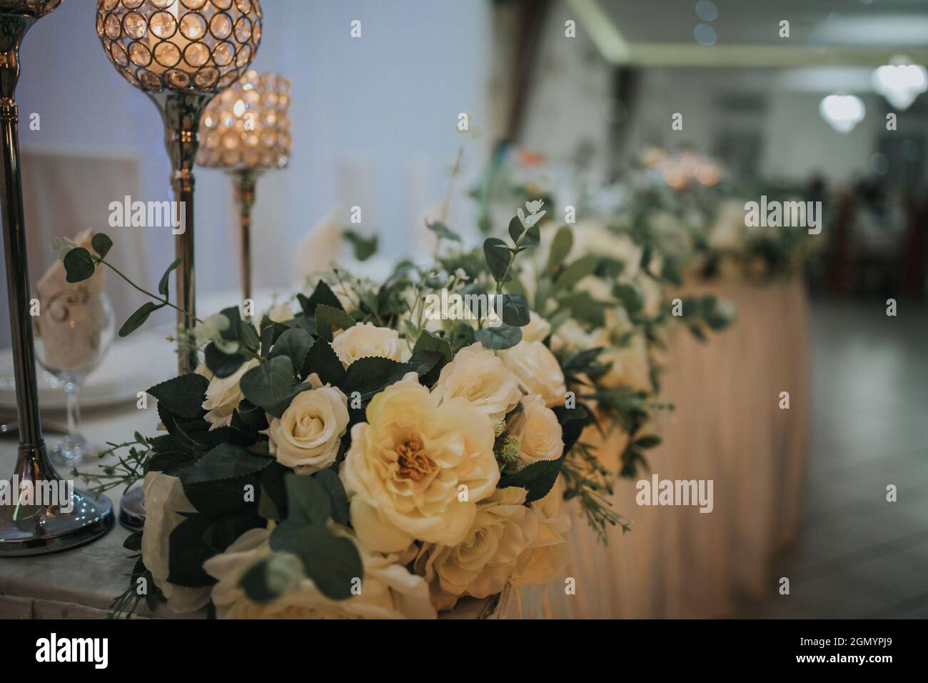 Wedding decorations and lightning fixtures on the table Stock Photo - Alamy