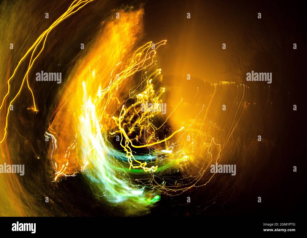 Using the city lights to capture these graphic images of twisting light ...