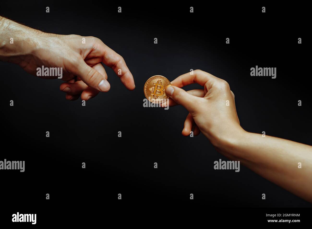 Bitcoin transfer concept from hand to hand Stock Photo - Alamy