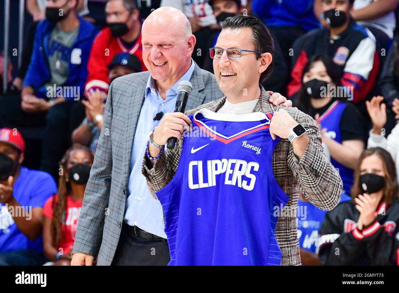 Intuit CEO Sasan Goodarzi is presented with a jersey during a ...