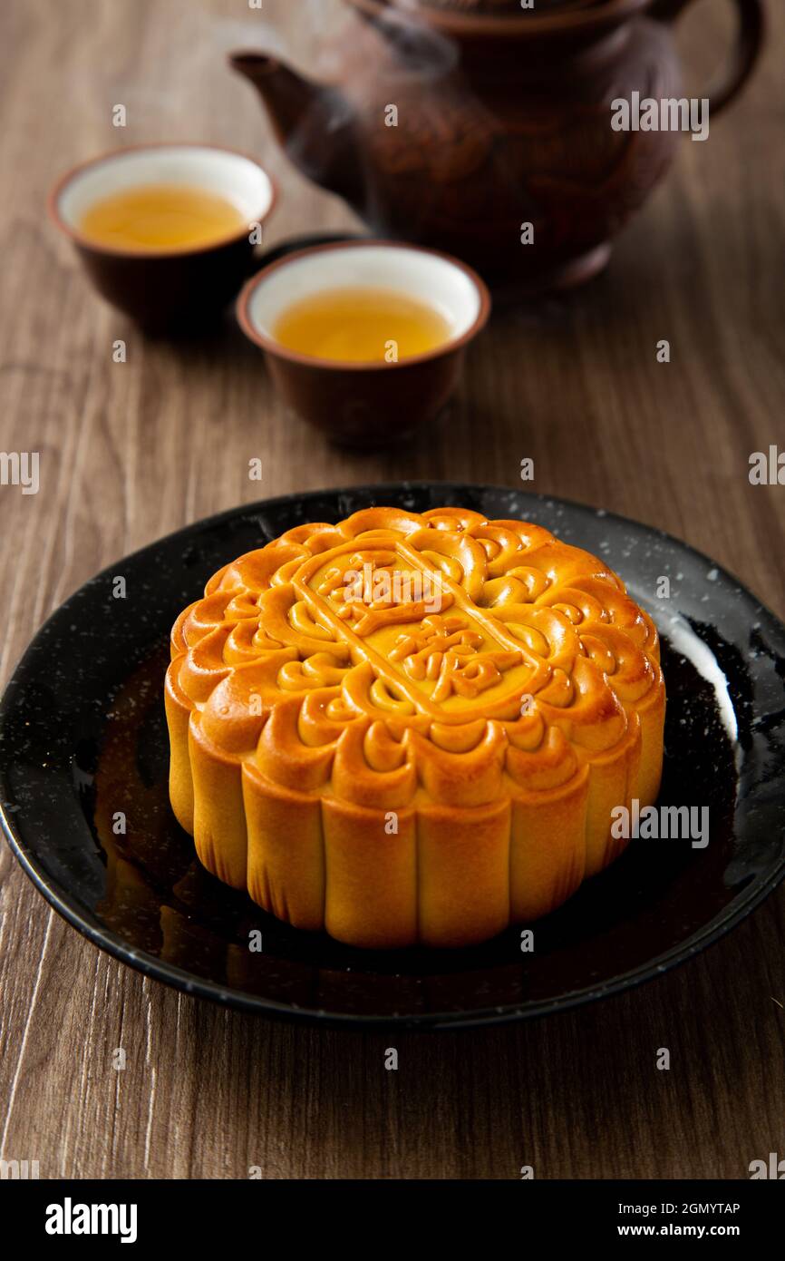 Moon cakes with Chinese tea. The Chinese character on the mooncake ...