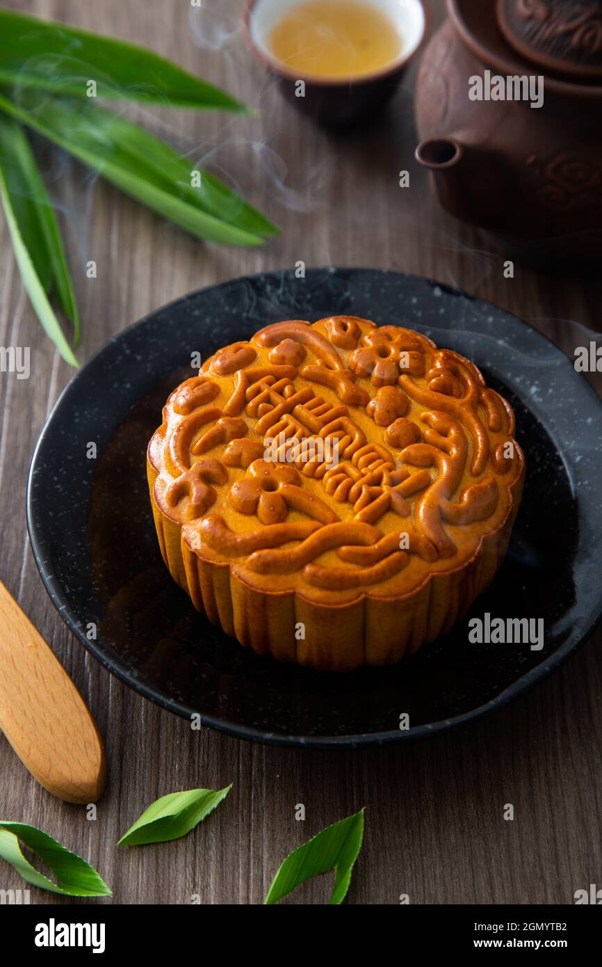 Moon cakes with Chinese tea. The Chinese character on the mooncake ...