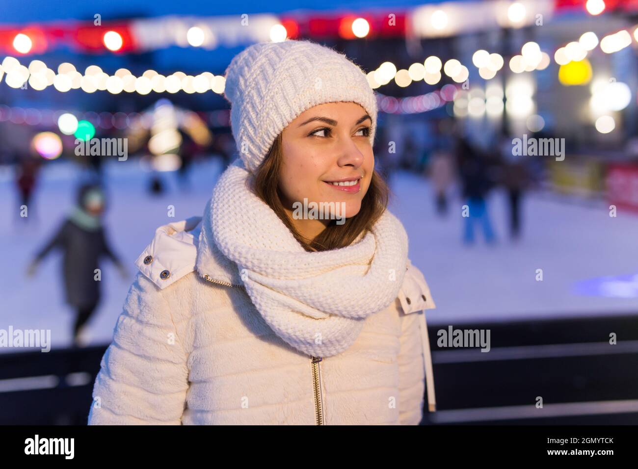 Christmas, winter, technology and leisure concept - happy young woman ...