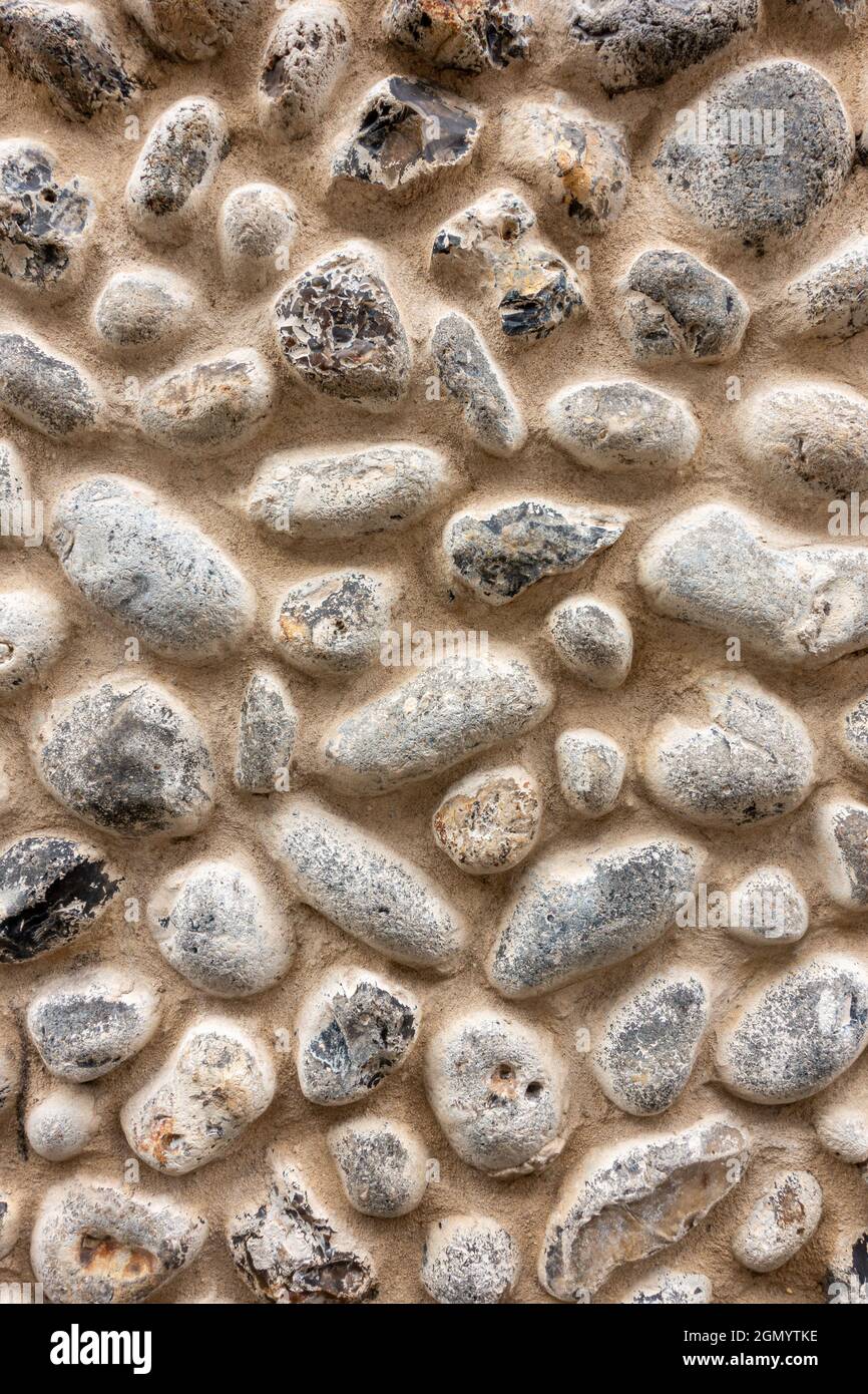Cobbled stone cement wall textured background Stock Photo - Alamy