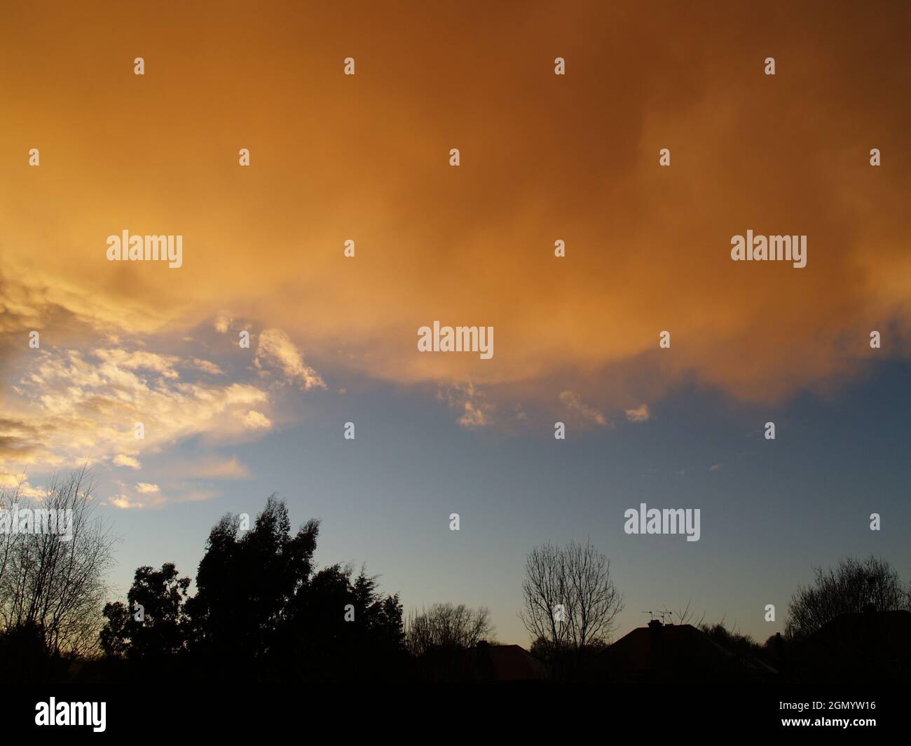 Winter squall line clearing at sunset in Suburban London as sky turns a ...