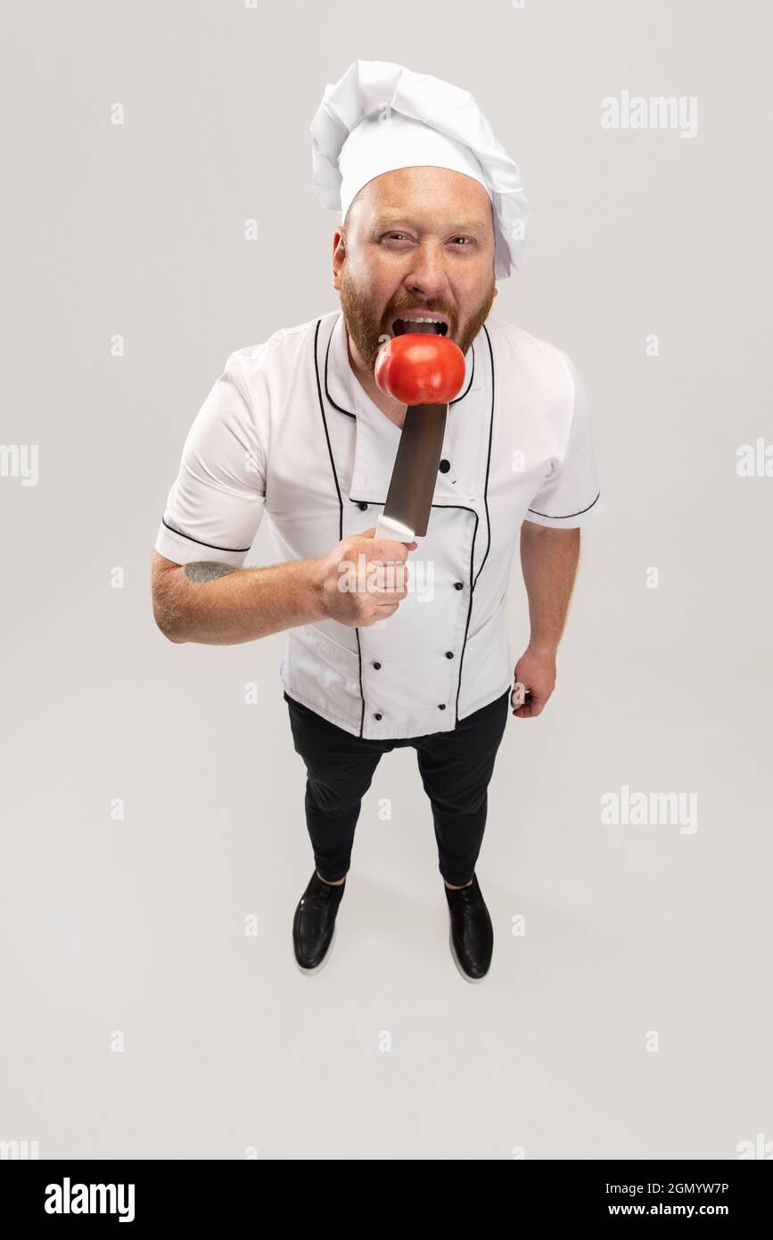 High angle view of hadsome bearded man, cook, male chef in white ...