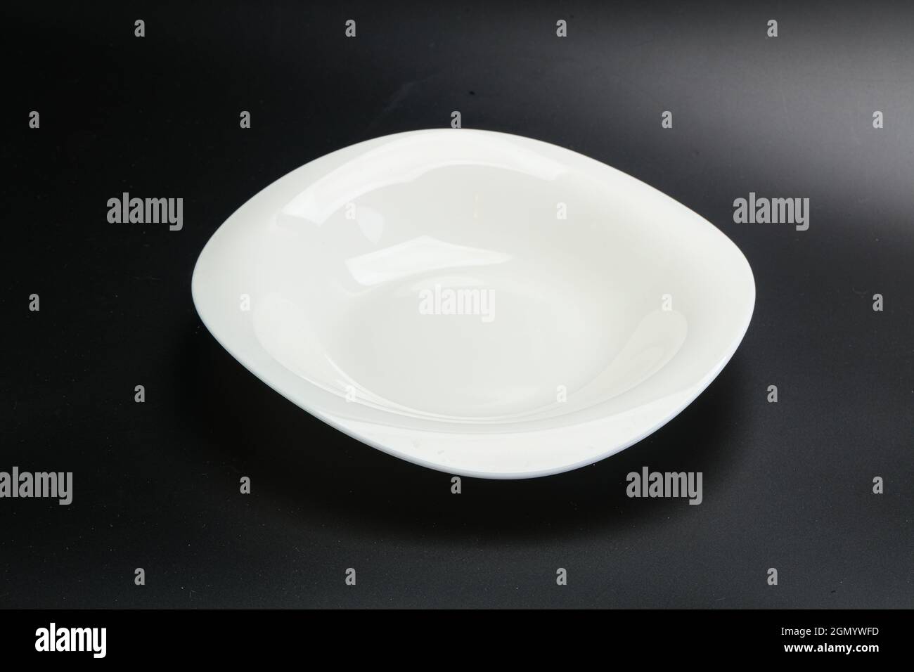 White empty plate for serving isolated Stock Photo - Alamy
