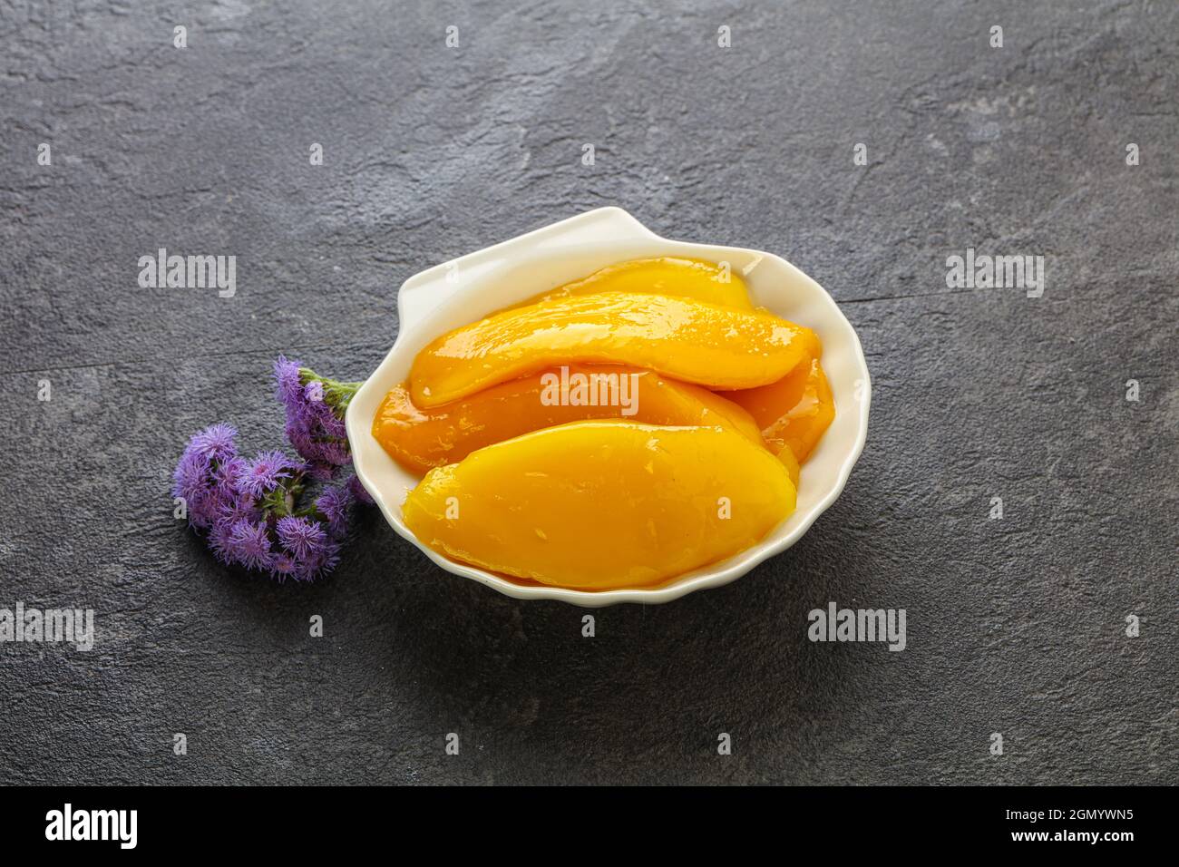 Sweet canned tropical fruit mango slices Stock Photo - Alamy
