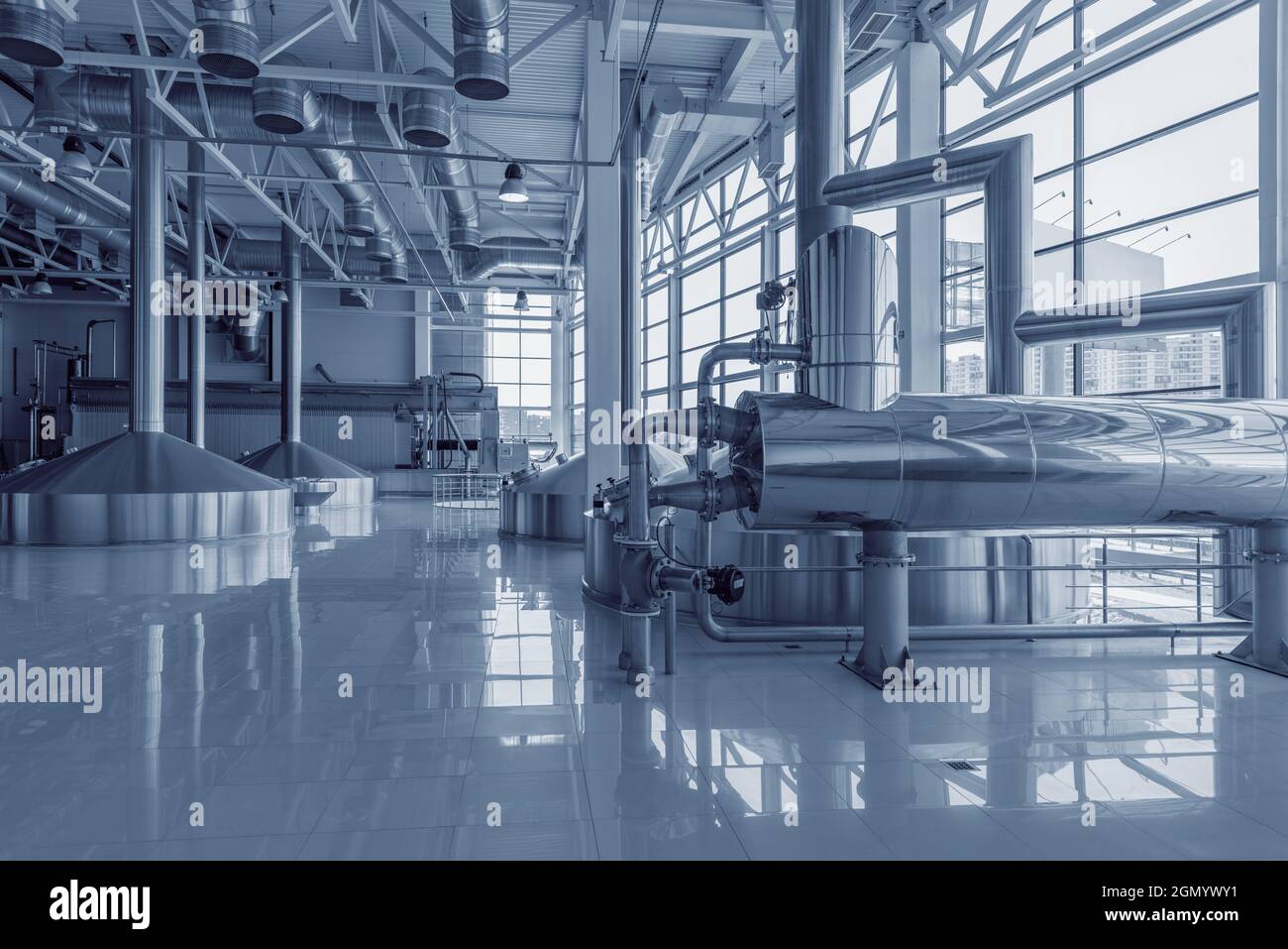 Equipment for brewing beer inside of the plant Stock Photo - Alamy
