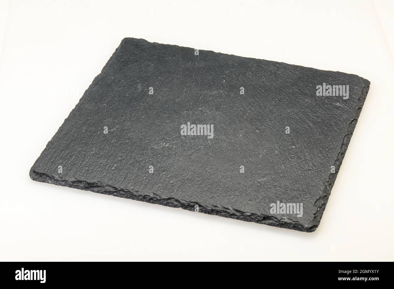 Black stone board for kitchen cutting Stock Photo - Alamy