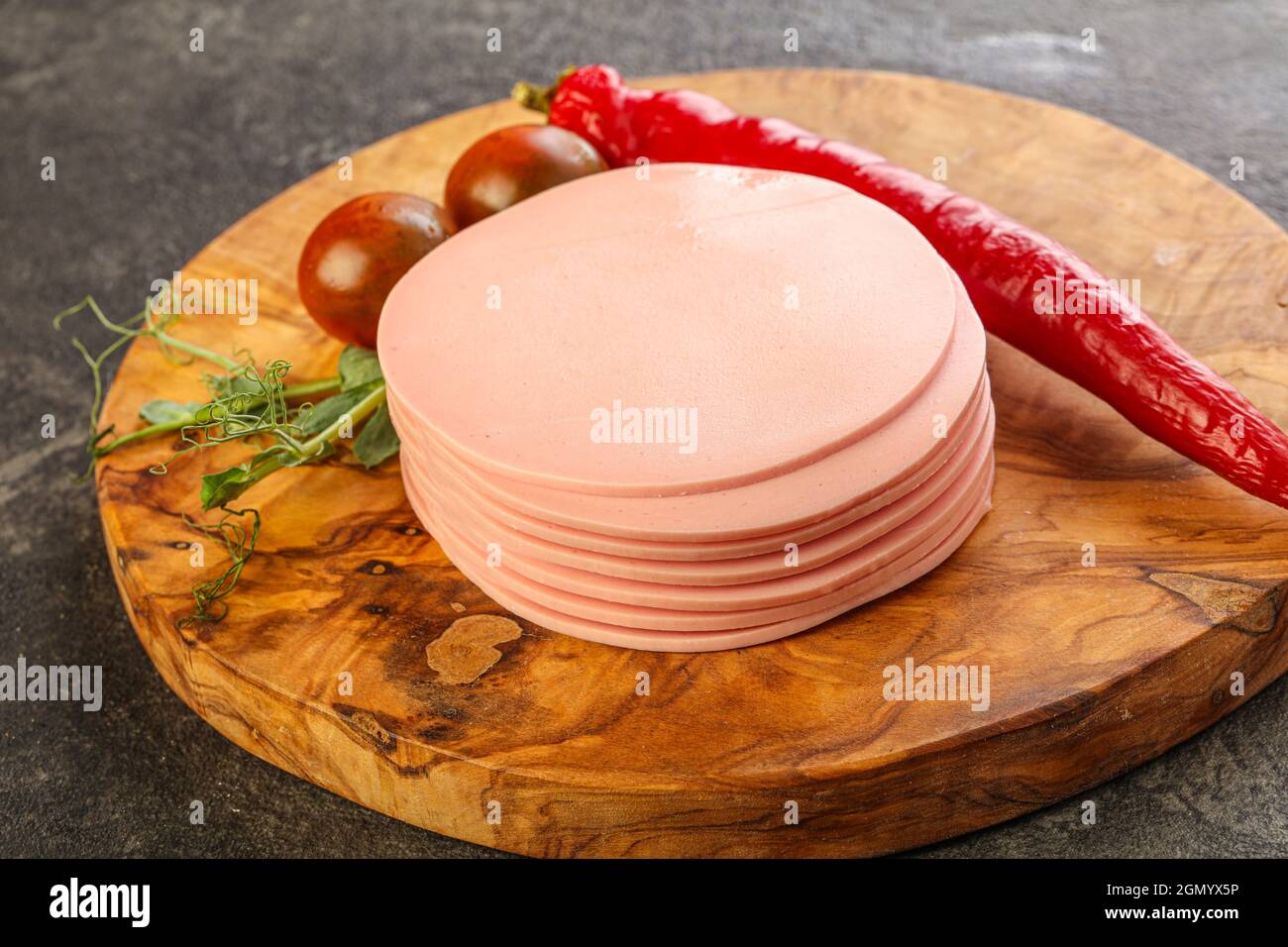 Sliced pork sausages stack over board for snack Stock Photo - Alamy