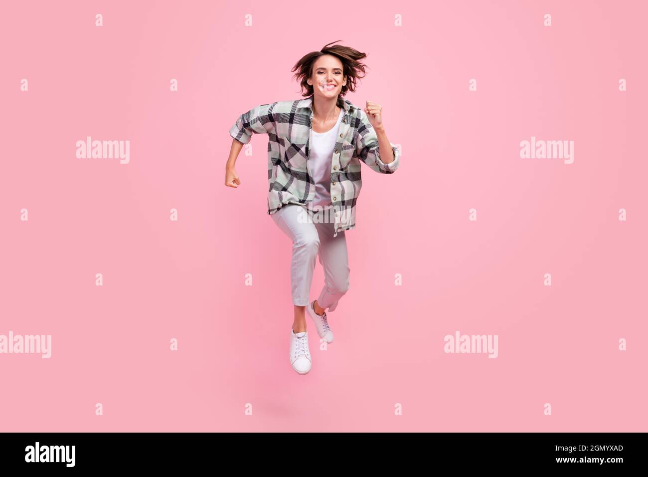 Full length photo of funny young brunette lady run wear shirt trousers ...