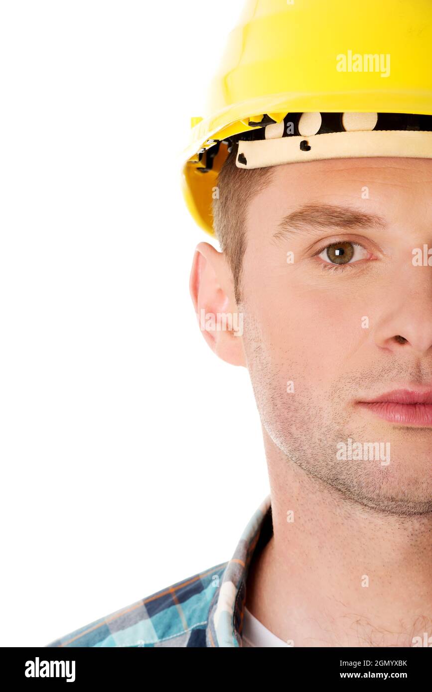 Portrait of a Polish man wearing a hard cap showing half-face isolated ...