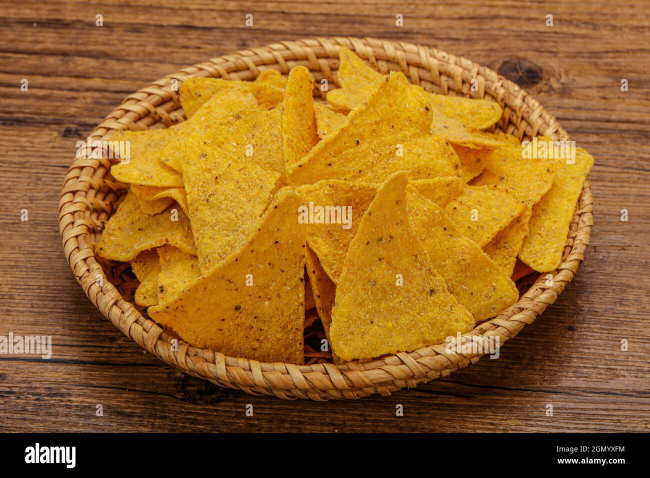 Mexican crunchy corn nachos triangle heap Stock Photo - Alamy