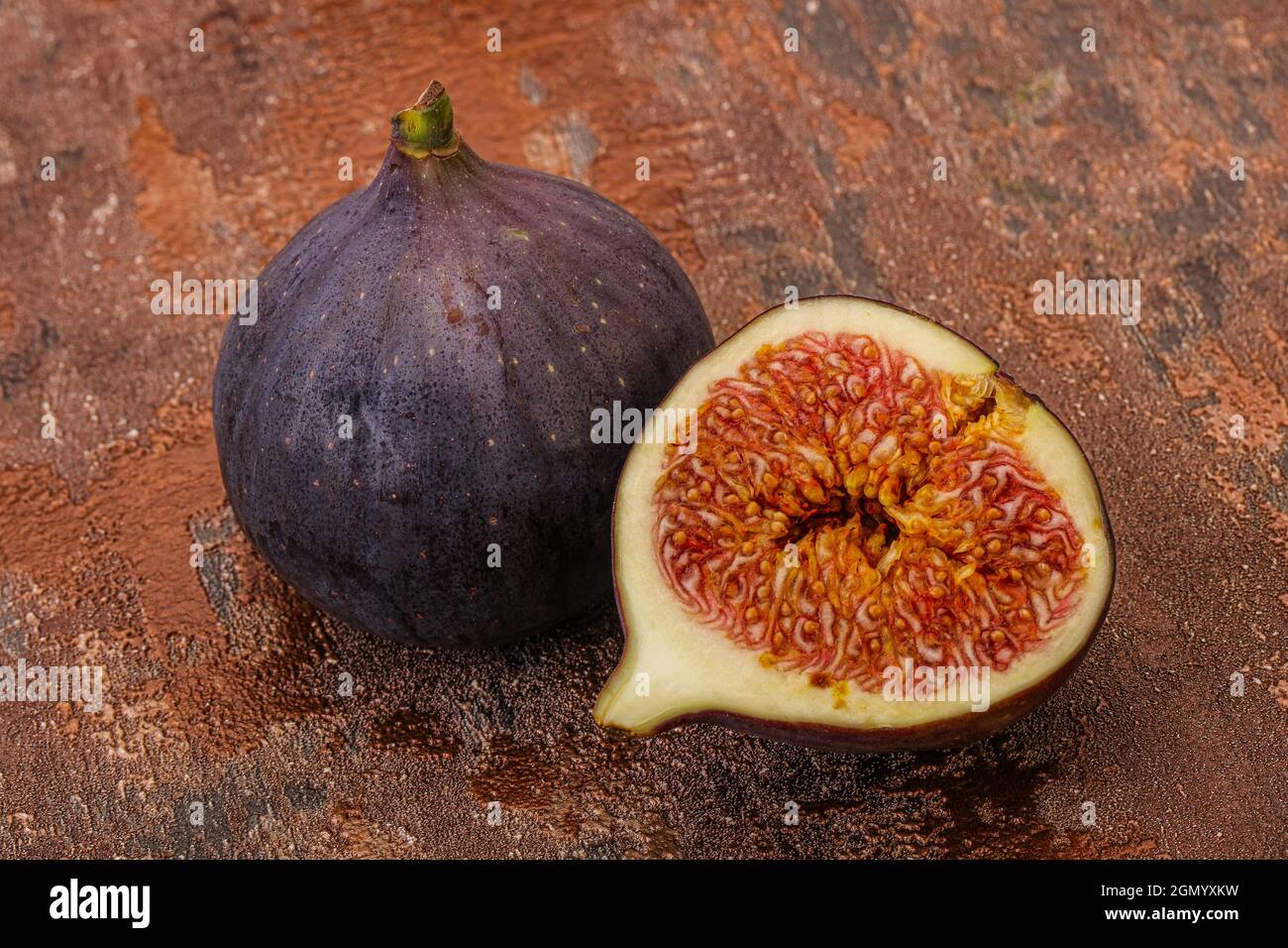 Sweet purple slice of fig fruit Stock Photo - Alamy