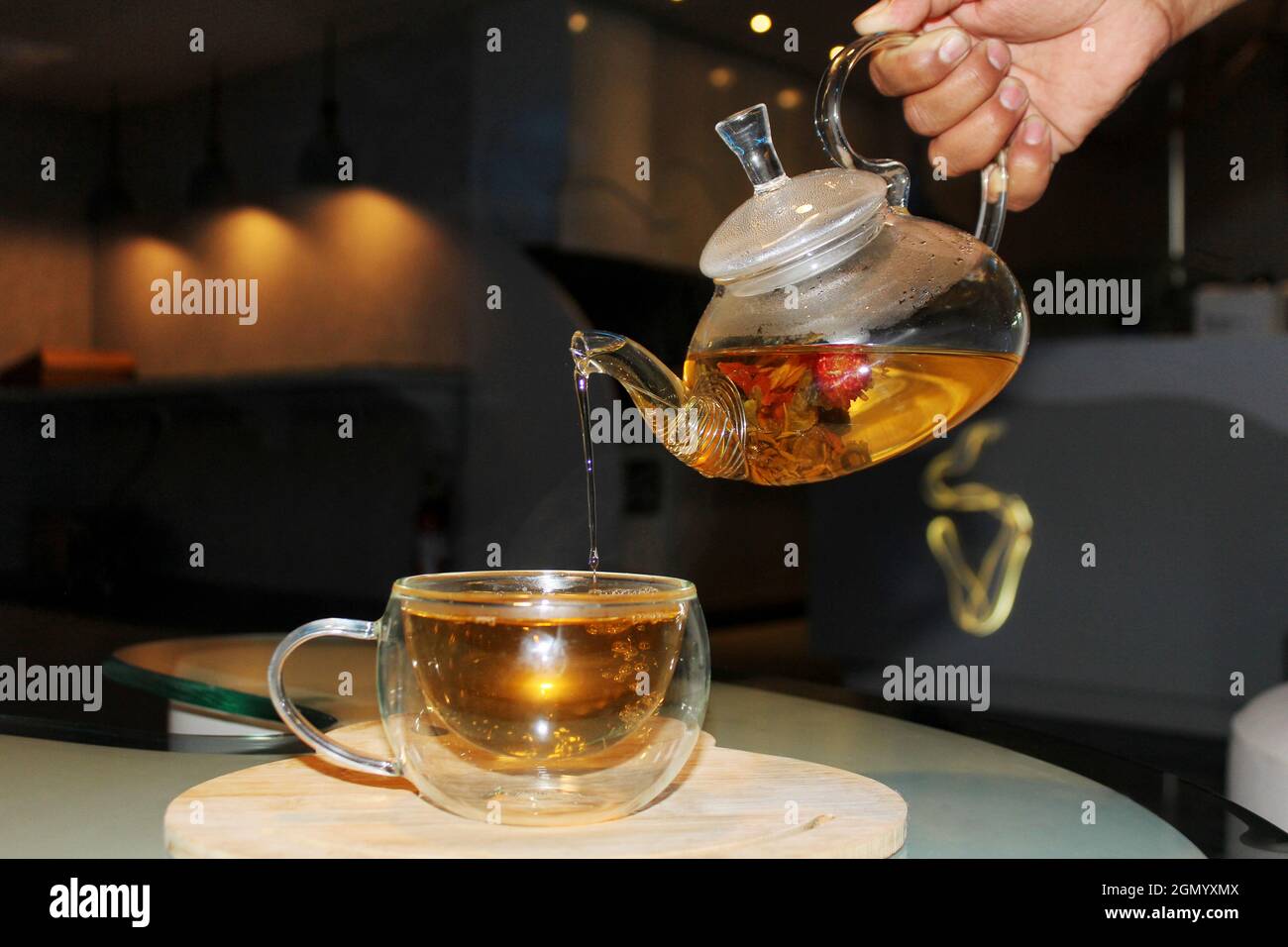 Tea pot pouring tea cup hi-res stock photography and images - Alamy