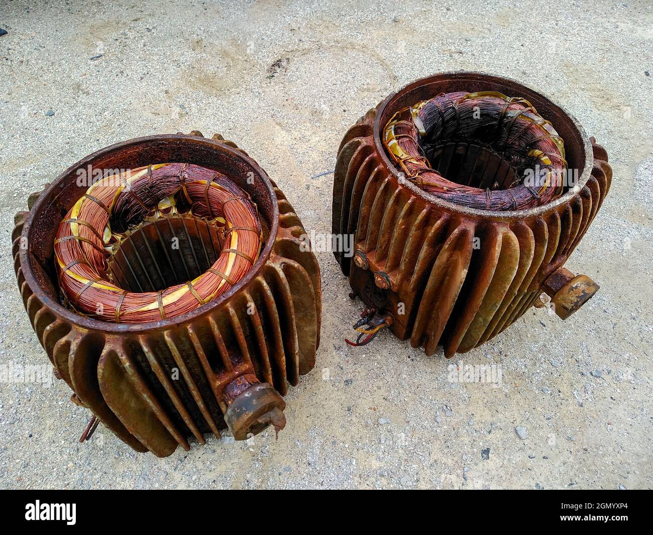 Closeup top view of two electric motors with copper wiring showing from ...