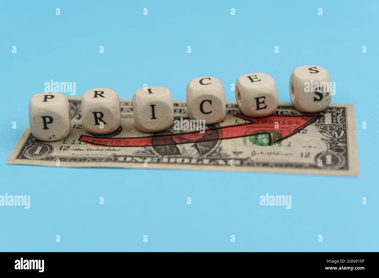 US dollar bill with a red arrow going up with the word Prices on top ...